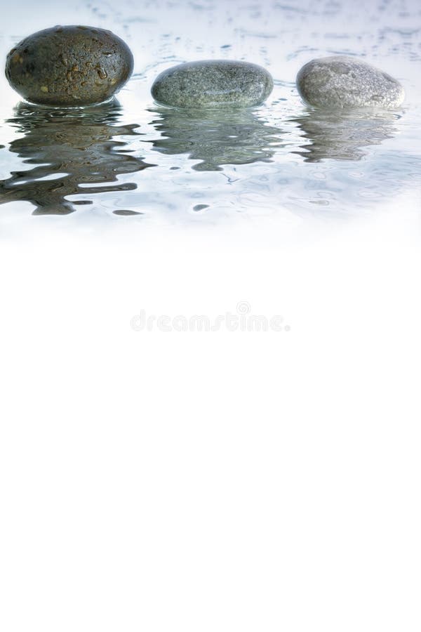 A Row of Stones in Water with Sun Beam Stock Photo - Image of peace ...