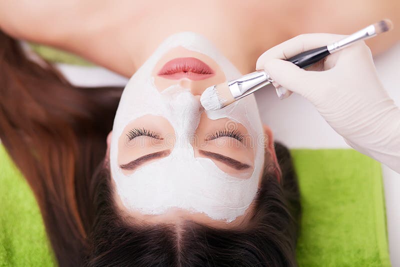 Spa Woman Applying Facial Cleansing Mask Beauty Treatments Stock Image