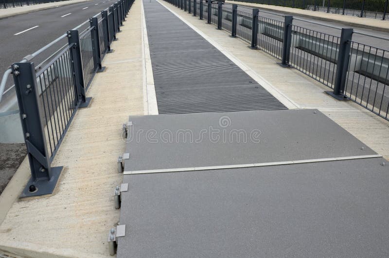 The Space between the Lanes of the Highway Bridge is Blocked by a Grid ...