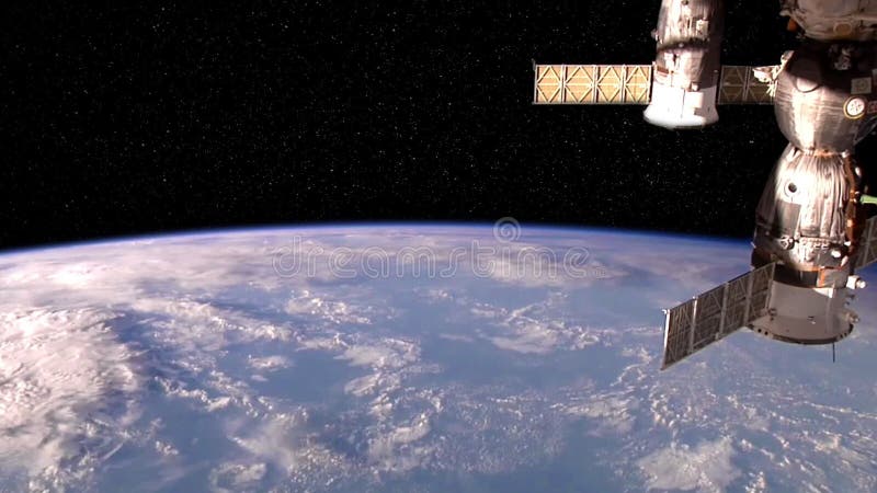 A Space Station Gracefully Orbits Over the Earth, Highlighting the ...