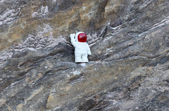 Spaceman in the rocks stock image. Image of explore - 243876757