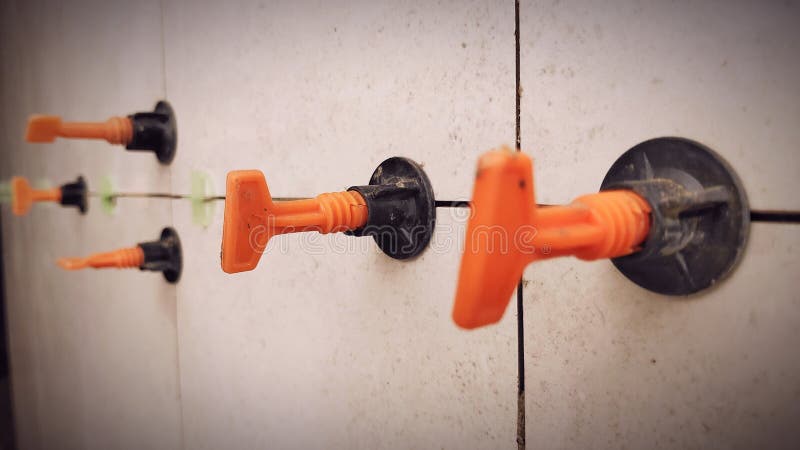 Spacer tile level ceramic stock photo. Image of project - 340994566