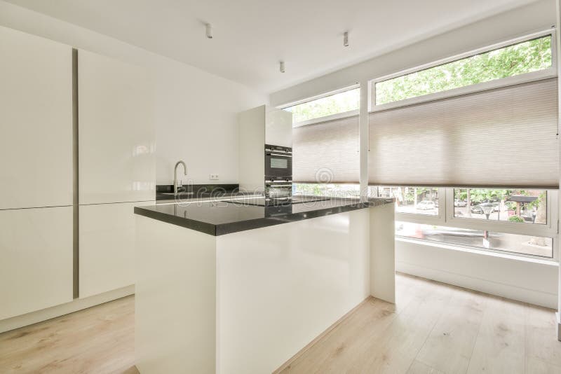 Spacious Bright White Kitchen with Windows Stock Photo - Image of floor ...