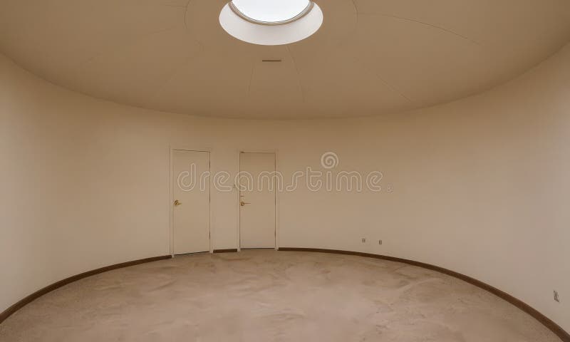 Spacious, Circular Room with Skylight and Two Closed White Doors ...