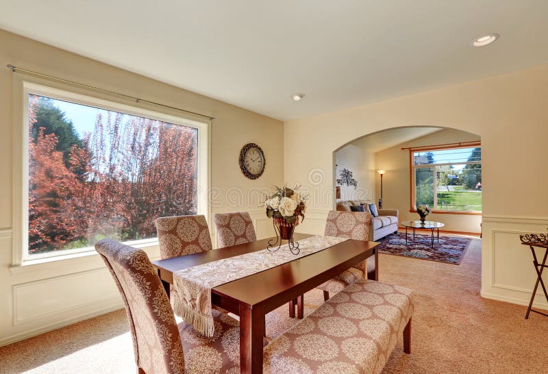 Spacious Dining Room Interior with Upholstered Bench Stock Photo ...
