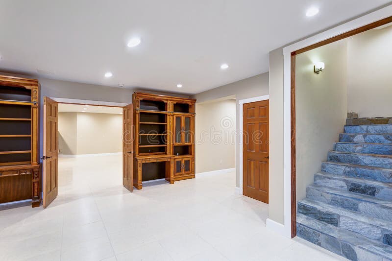 Spacious Empty Basement Area with Custom Built Bookcases. Stock Image ...