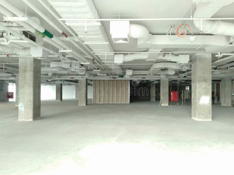 Spacious Empty Commercial Interior with Exposed Ceilings and Structural ...