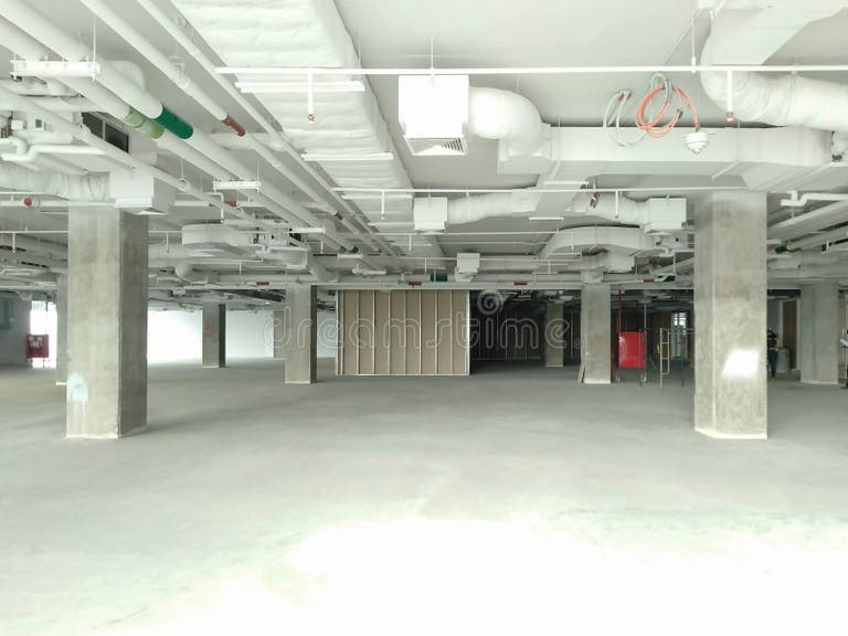 Spacious Empty Commercial Interior with Exposed Ceilings and Structural ...