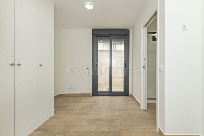 Spacious Empty Room with Integrated White Wooden Dressing Area, Top ...