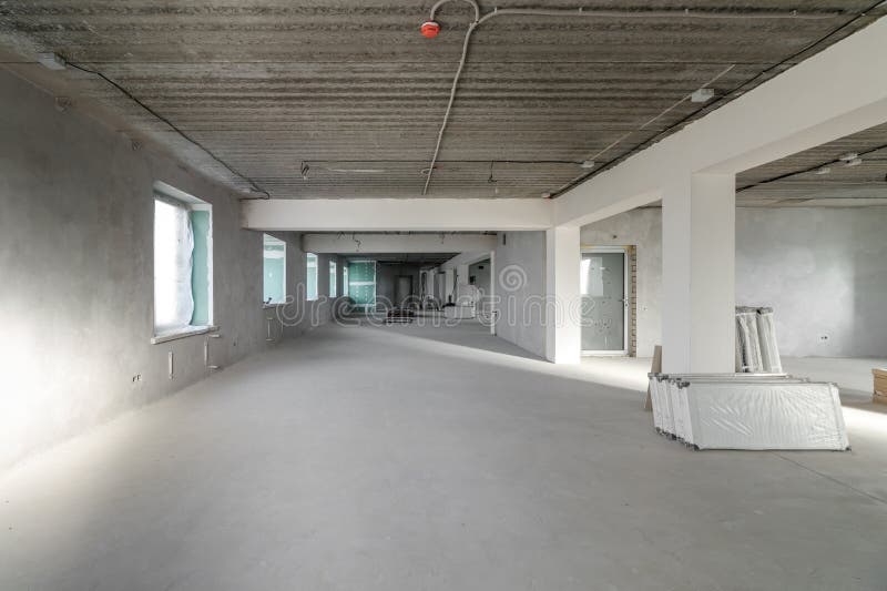 Spacious Empty Rooms in the Attic Floor after Filling Out the Work on the Wall and Ceiling Stock ...