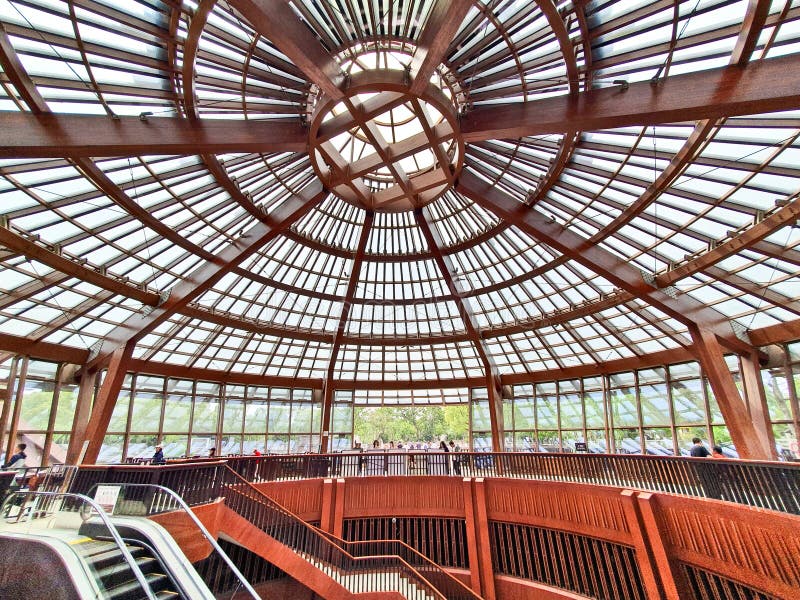 A Spacious Indoor Structure with a Large Wooden Dome Ceiling and Glass ...