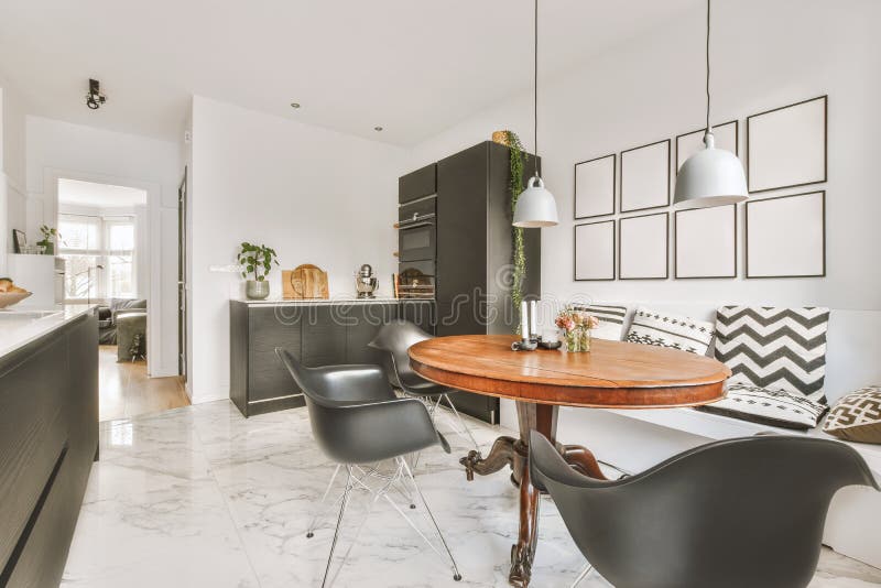 A Spacious Kitchen in Black Combined with a Dining Area Stock Photo ...