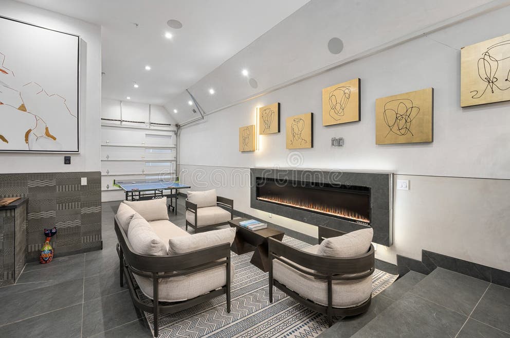 Spacious Room with Sofas, a Cozy Fireplace, and a Ping-pong Table Stock ...