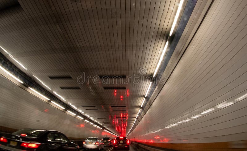 The Inside of a Large Tunnel with Cars Moving on it Stock Photo - Image ...