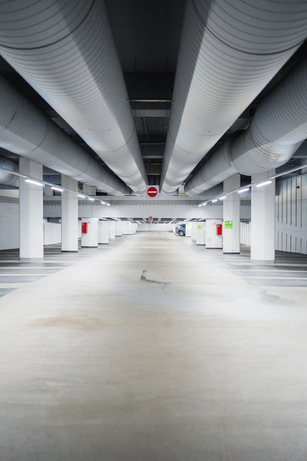 Spacious Underground Parking Garage with Illuminated Ceiling and Empty ...