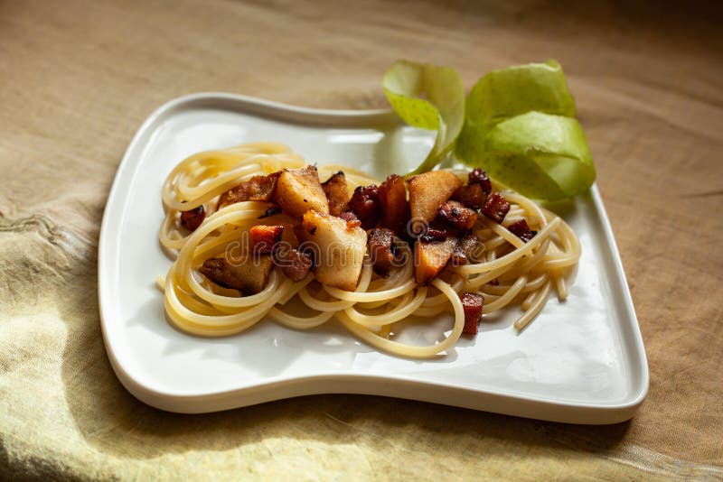 Spaghetti with Bacon, Apples and Ginger Stock Photo - Image of style ...