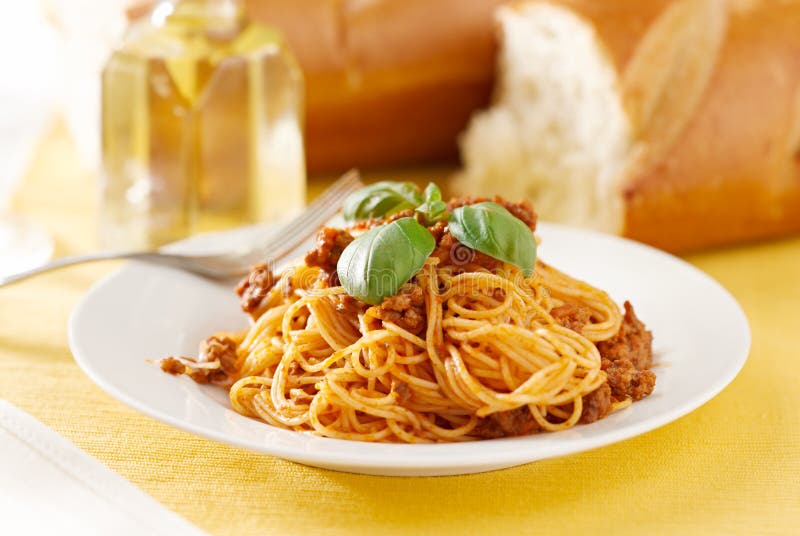 Spaghetti with Basil Garnish in Meat Sauce Stock Photo - Image of lunch ...