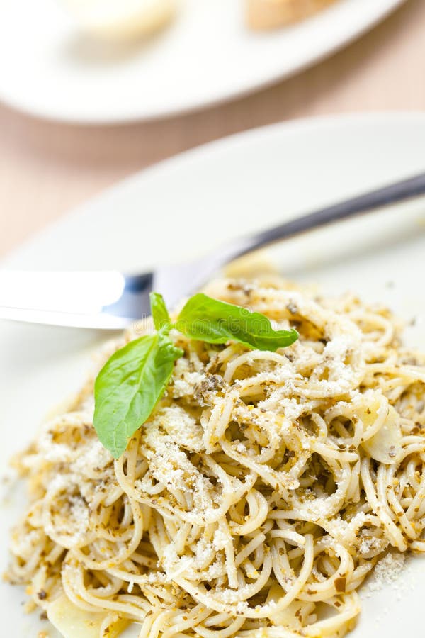 Spaghetti with basil pesto stock photo. Image of herb - 16044628
