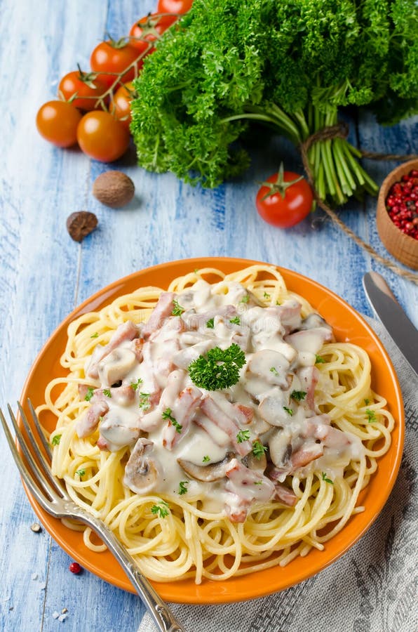 Spaghetti with Bechamel Sauce, Mushrooms and Bacon Stock Photo - Image ...