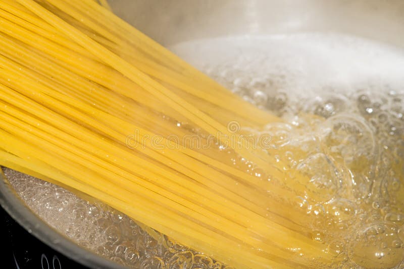 Spaghetti in boiling water stock photo. Image of cook - 38803602