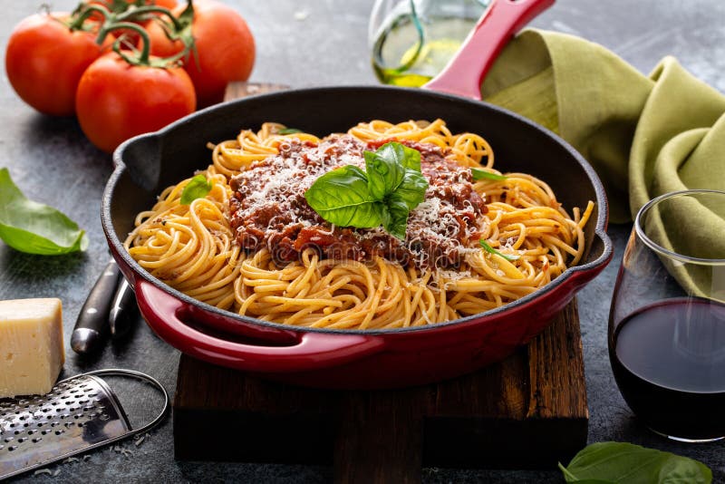 Spaghetti Bolognese in a Cast Iron Pan Stock Photo - Image of leaf ...