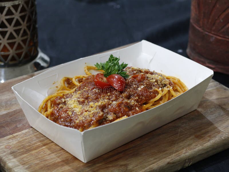 Spaghetti Bolognese with a Paper Holder Stock Image - Image of holder ...