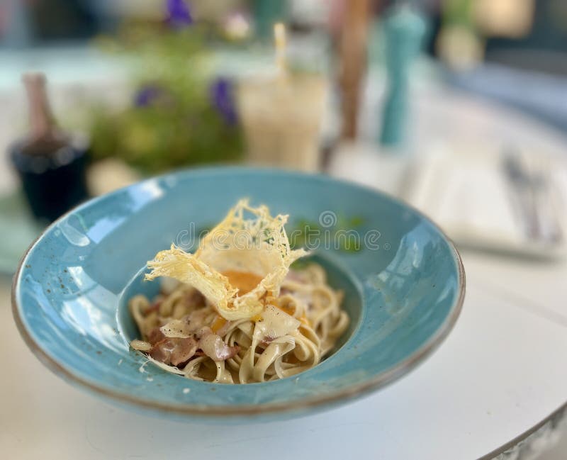 Spaghetti Carbonara with Bacon and Egg in Blue Plate Stock Image ...