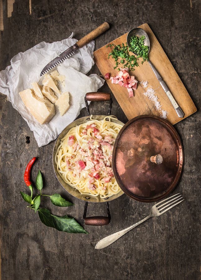 Spaghetti Carbonara in Copper Pan with Parmesan, and Herbs on Cutting ...