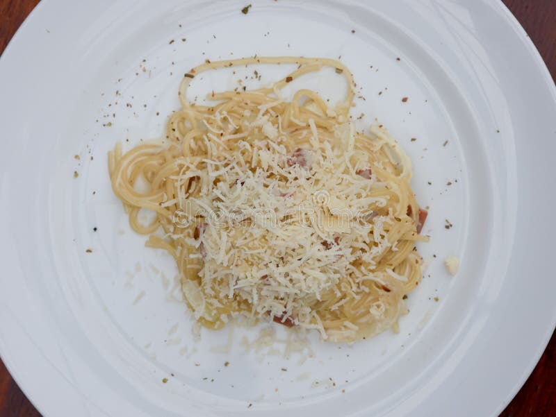 Spaghetti with Cheese and Pepper on a White Plate Stock Photo - Image ...