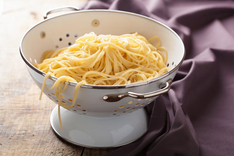 Spaghetti in colander stock image. Image of yellow, golden - 27527655