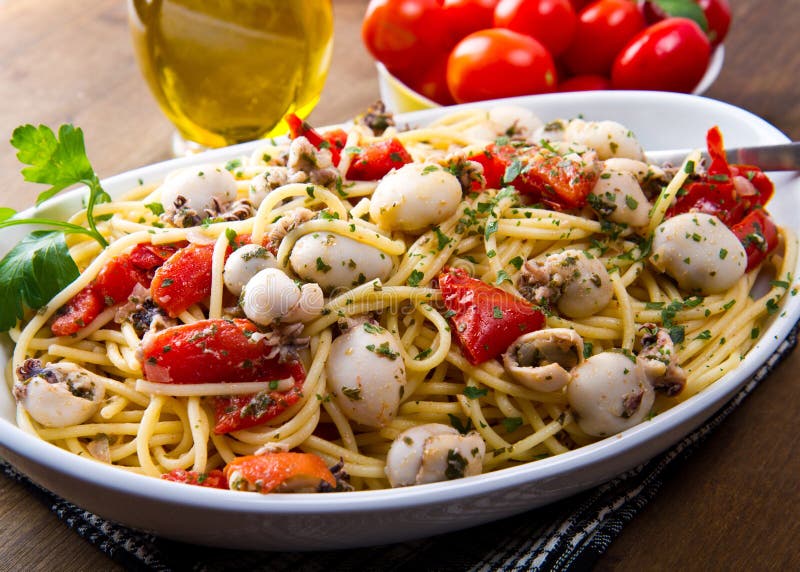 Spaghetti with Cuttlefish and Tomatoes Stock Image - Image of ...