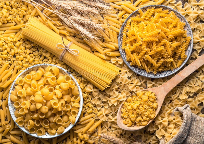 Spaghetti and Different Types of Pasta in a Plate and on the Table ...