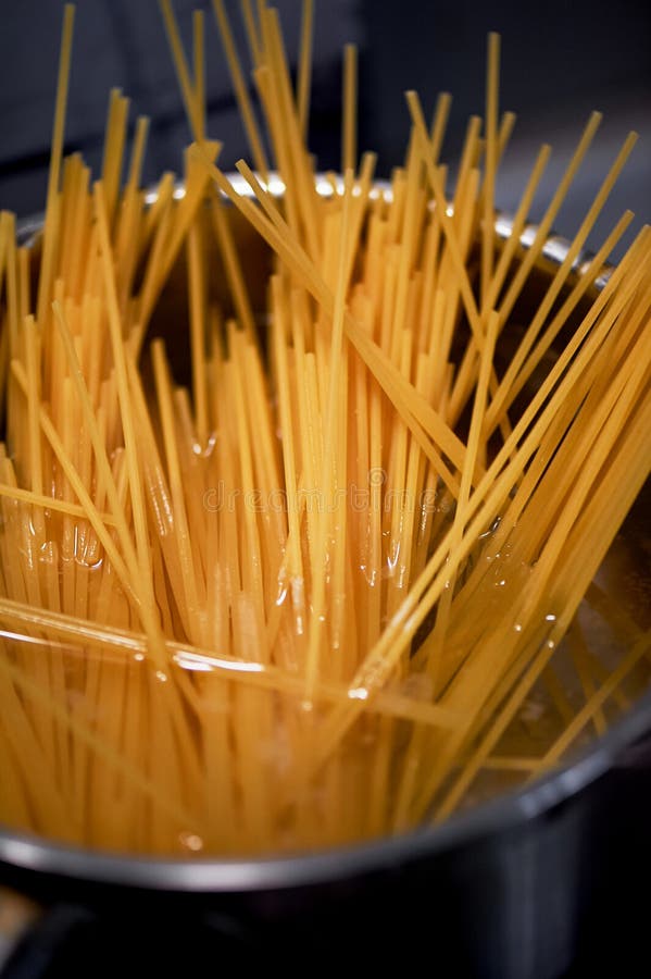 Spaghetti from Durum Wheat are Cooked in a Metal Pot on the Fire Stock ...