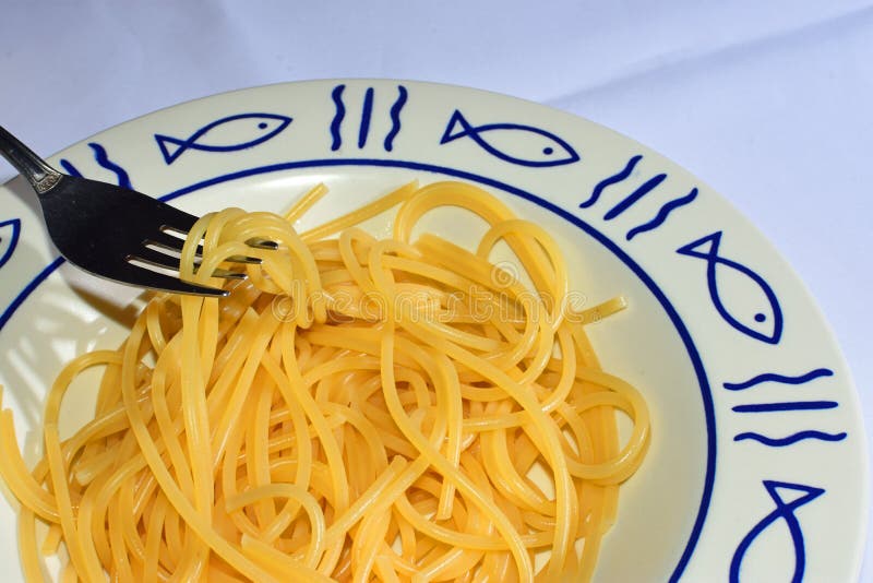 Spaghetti with Folk on Plate with Fish Design. Stock Image - Image of ...