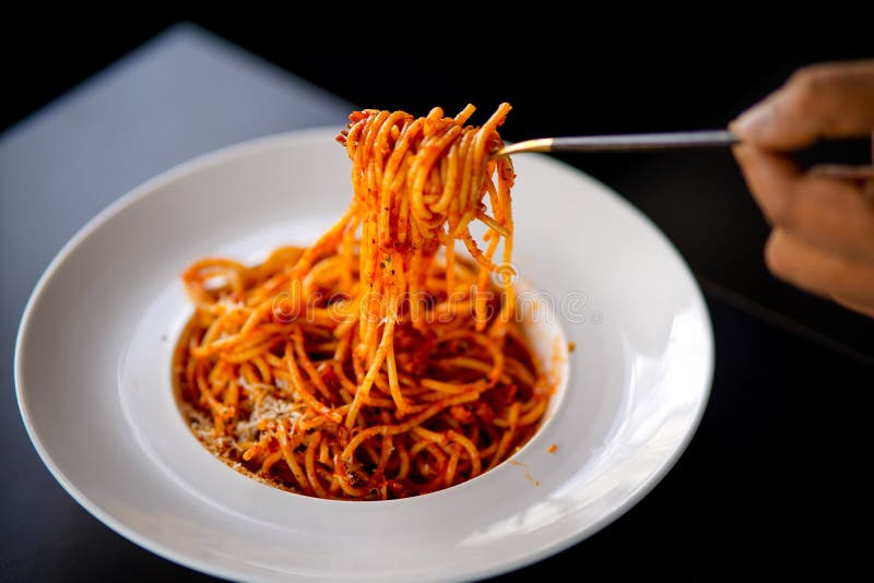 Spaghetti on a Fork. Girl Use Fork with Spaghetti. Pasta with Red Sauce ...