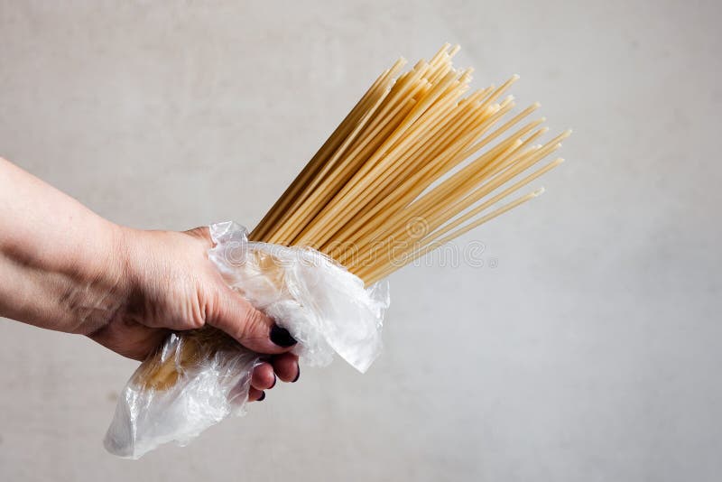 Spaghetti in hand stock image. Image of cook, ingredient - 182365471