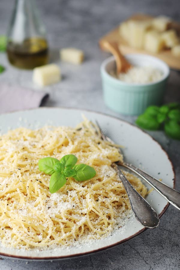 Spaghetti with Italian Cheese Pecorino Romano Stock Photo - Image of ...