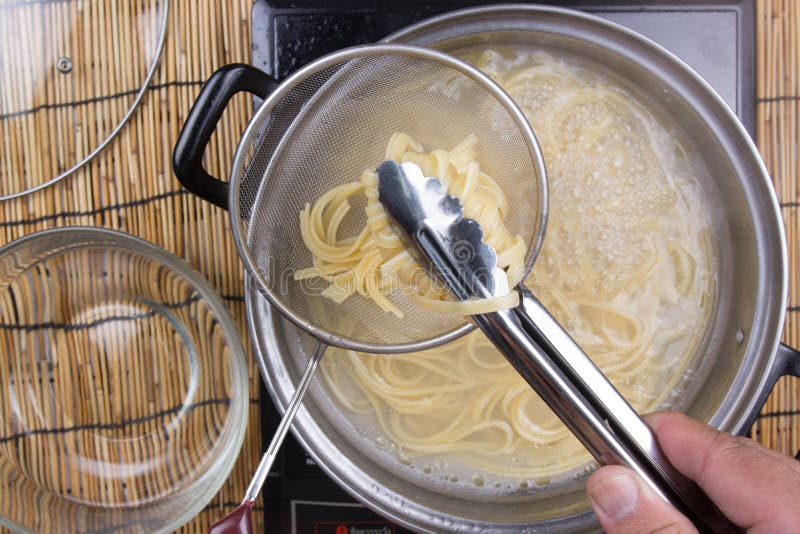 Spaghetti Lifted on of Cold Water with Tongs Stock Image - Image of ...
