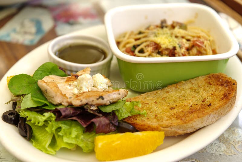 Spaghetti , Mixed Green Salad and Chicken Lunch Set Stock Image - Image ...