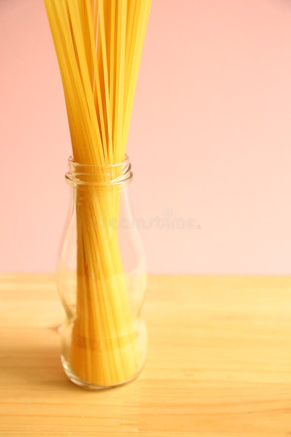 Spaghetti Noodles in Glass Bottle Stock Photo - Image of empty, closeup ...