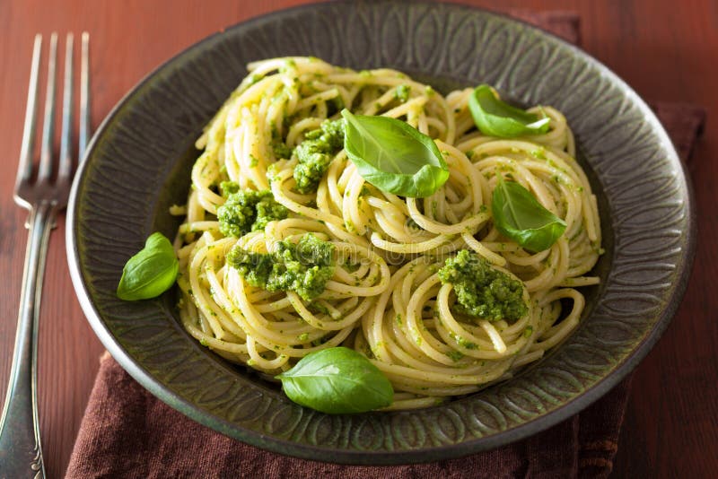 Spaghetti Pasta with Pesto Sauce Over Rustic Table Stock Image - Image ...