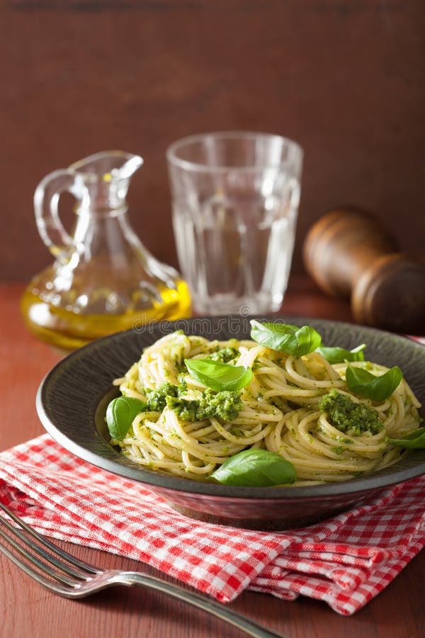 Spaghetti Pasta with Pesto Sauce Over Rustic Table Stock Image - Image ...