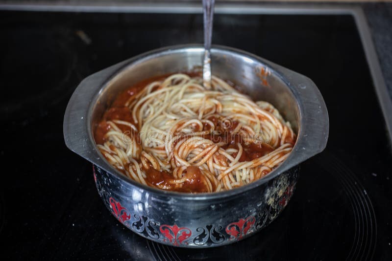 Spaghetti pasta in a pot stock photo. Image of cooking - 192978986