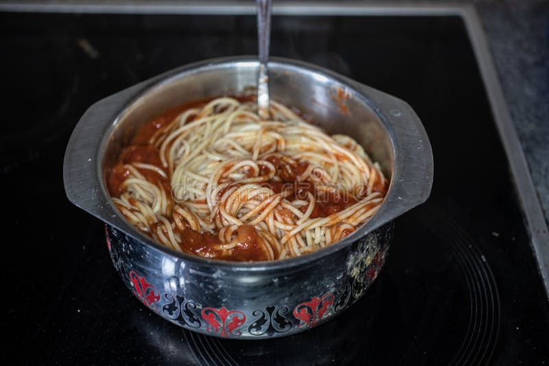 Spaghetti pasta in a pot stock photo. Image of cooking - 192979004