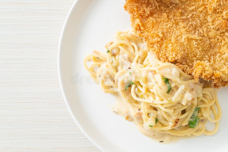 Spaghetti Pasta White Cream Sauce with Fried Fish Stock Photo - Image ...