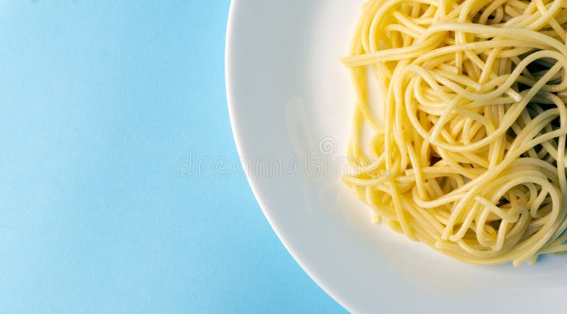 Spaghetti Pasta on a White Plate on a Blue Background. Creative ...