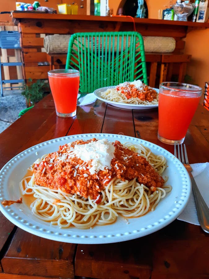Spaghetti Plate with Juice on Wooden Rustic Table Stock Image - Image ...