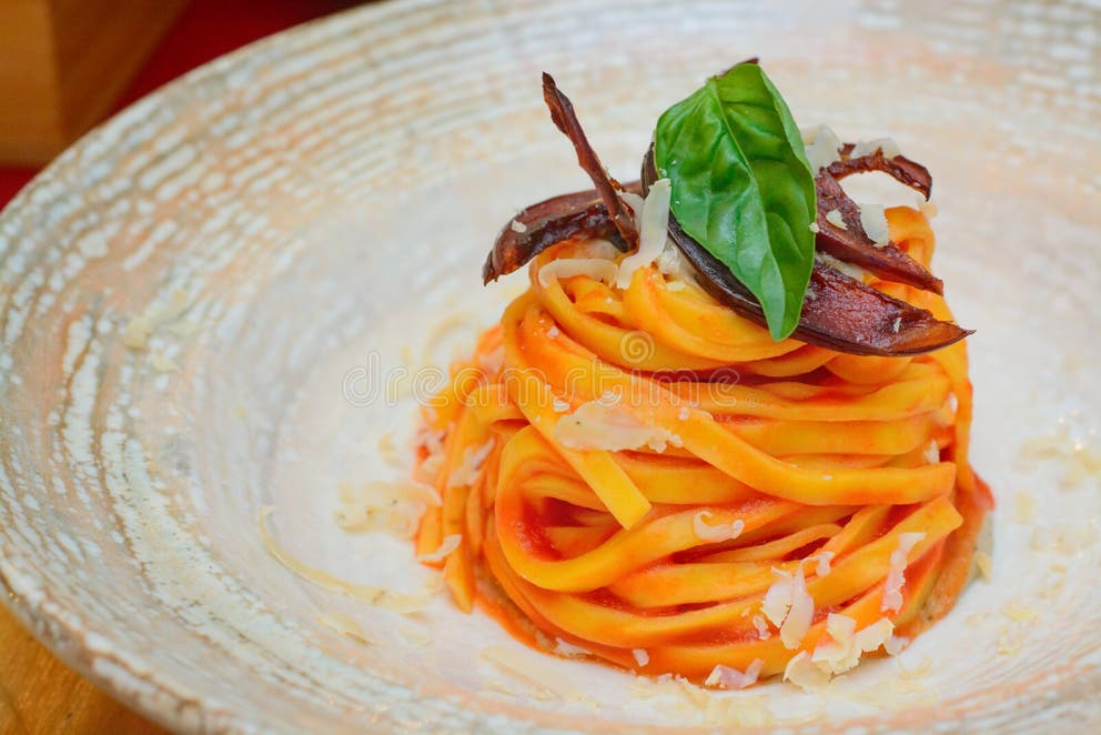 Spaghetti with a Leaf of Basil Stock Photo - Image of spaghetti ...