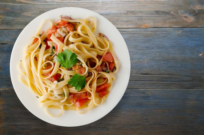 Spaghetti on a plate stock photo. Image of garnish, basil - 103386086