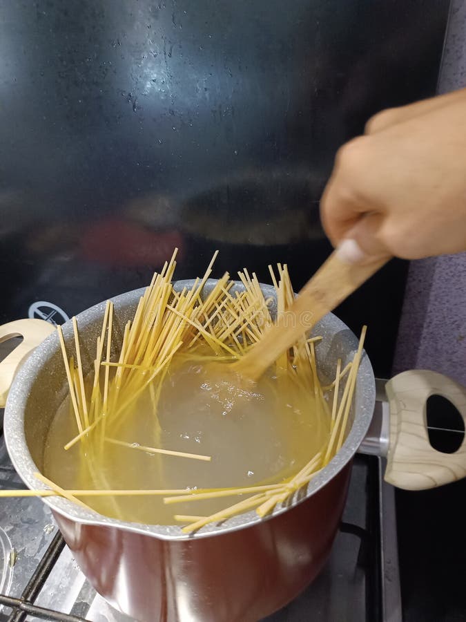 The Spaghetti in the Pot of Boiling Water Must Be Turned Over To ...